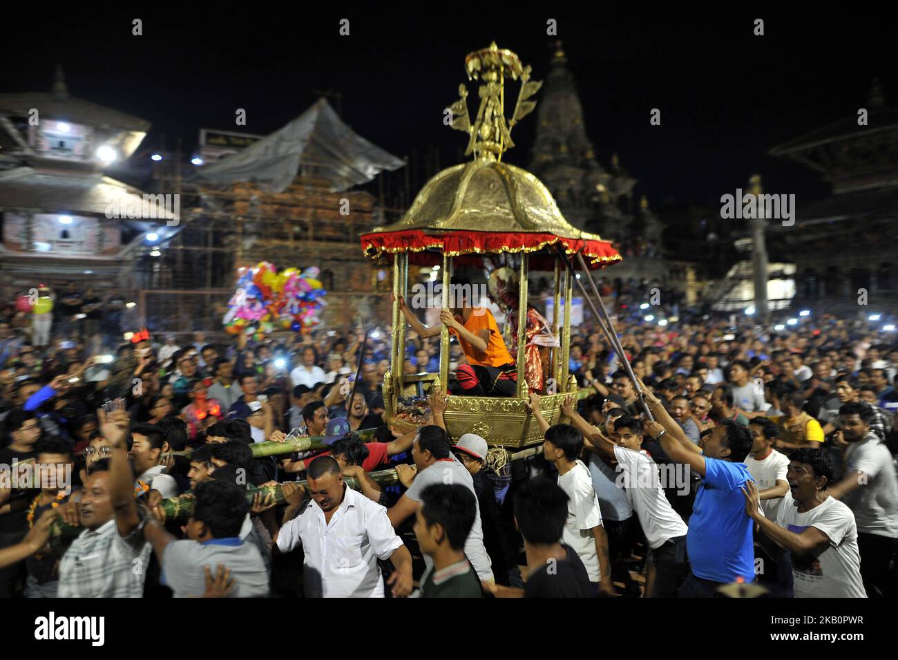 Nepalese Devotees carry a chariot of Lord Bhimsen during the Bhimsen ...