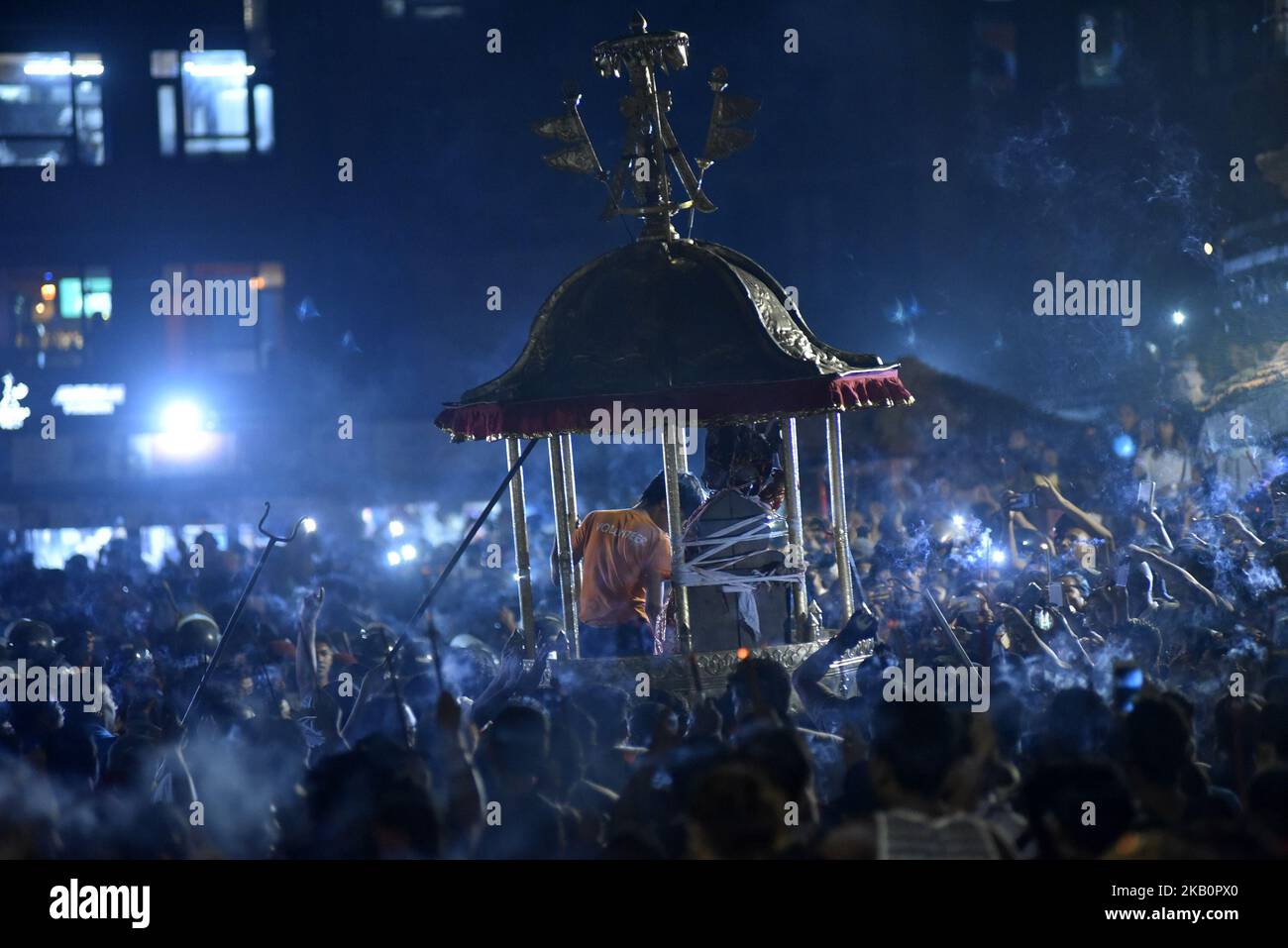 Nepalese Devotees carry a chariot of Lord Bhimsen during the Bhimsen ...