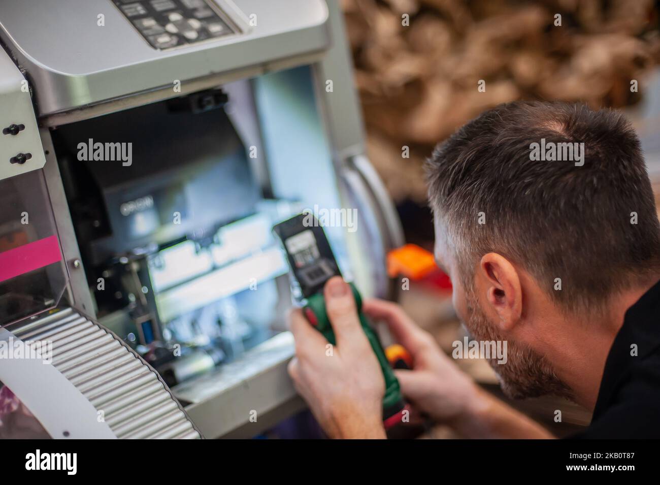 All machines nead maintains. Professional technician troubleshooting ...