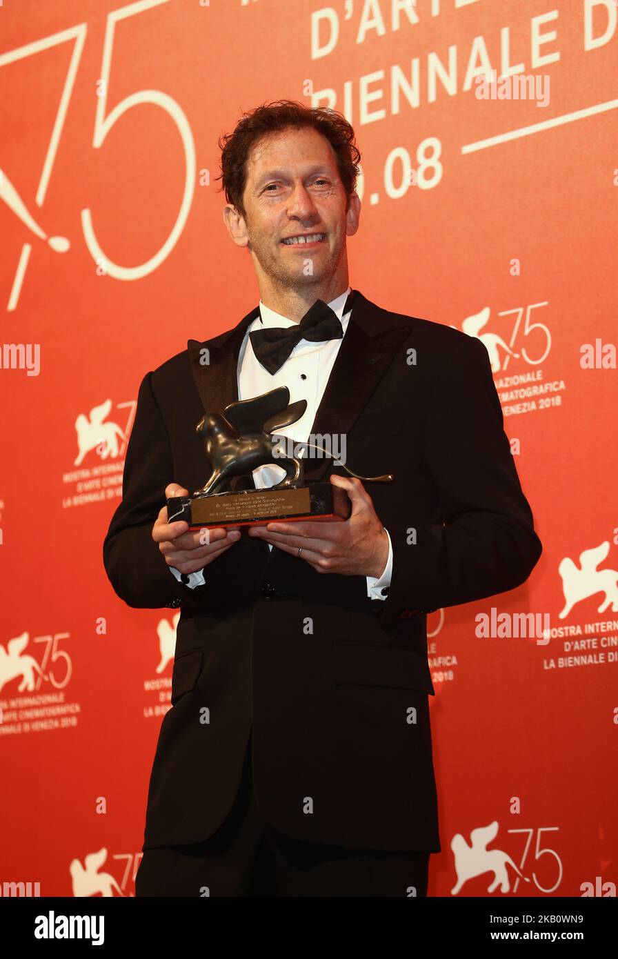 Tim Blake Nelson poses with the Best Screenplay Award for 'The Ballad ...