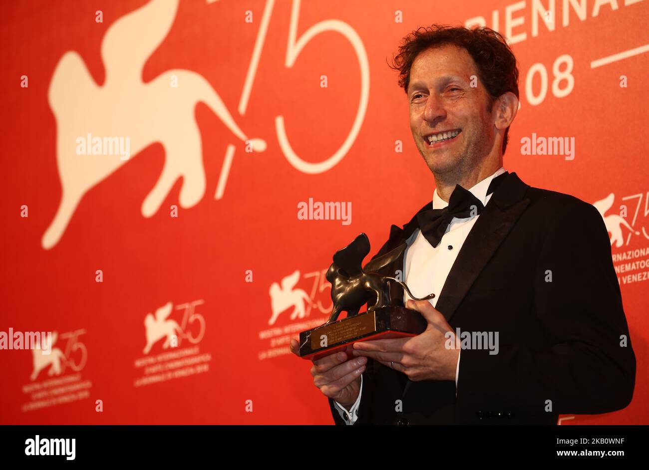 Tim Blake Nelson poses with the Best Screenplay Award for 'The Ballad ...