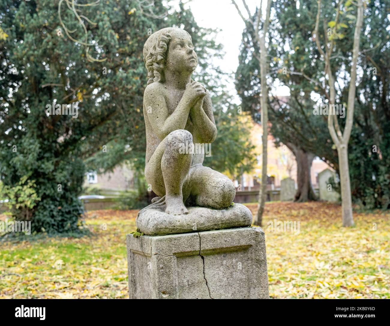 Religious Christ Child stone statue in a church yard Stock Photo - Alamy