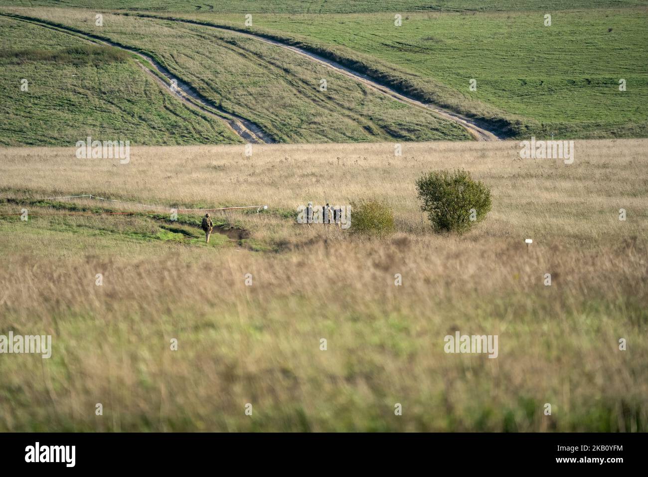 British army soldiers on a military training exercise in open countryside, Wiltshire UK Stock ...
