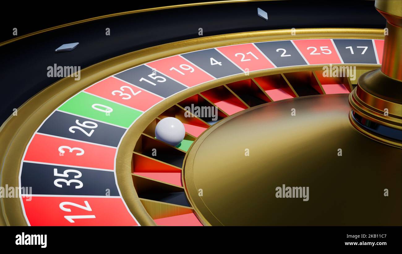 A white ball stopped at the number zero on a gold and black roulette ...