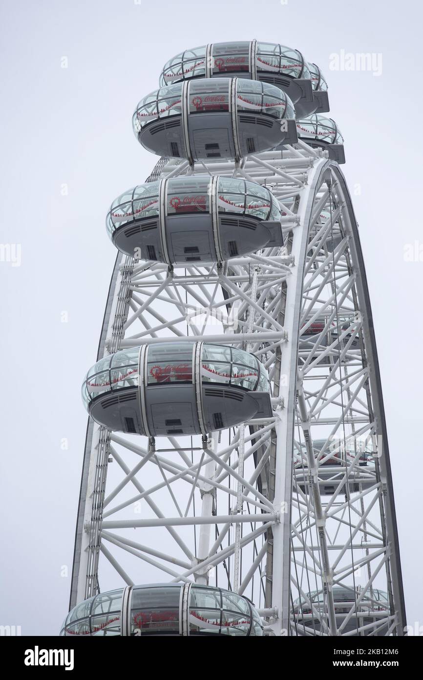 London Eye during a cloudy day in London, UK. The London Eye is one of ...