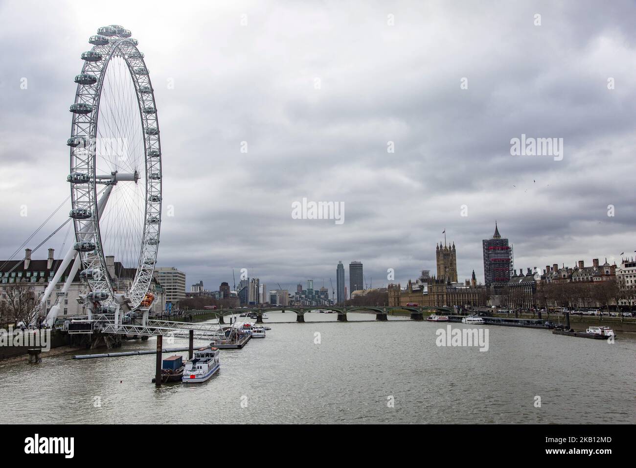 London Eye during a cloudy day in London, UK. The London Eye is one of ...