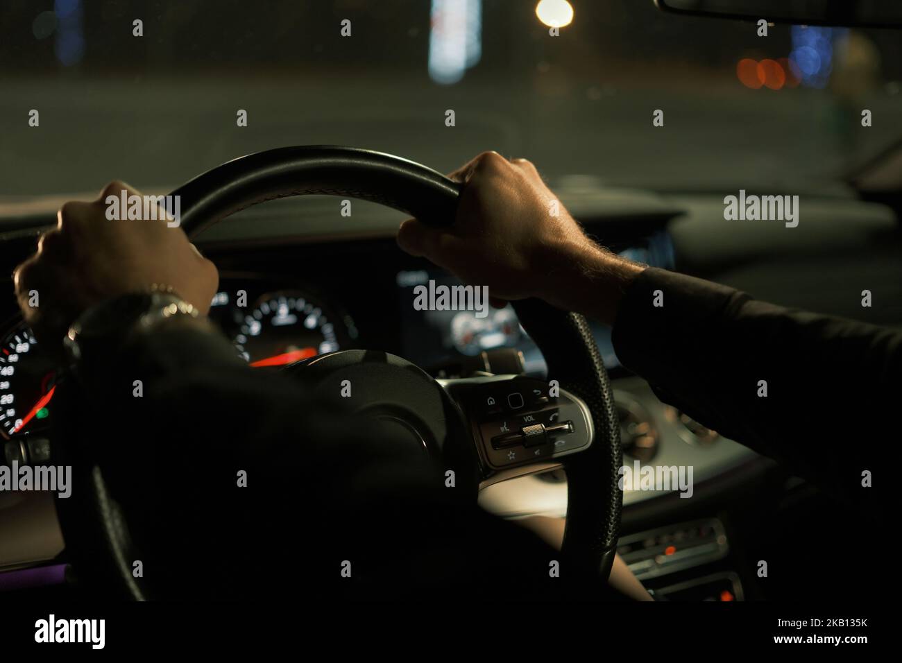 The adult man driving car at the night Stock Photo - Alamy