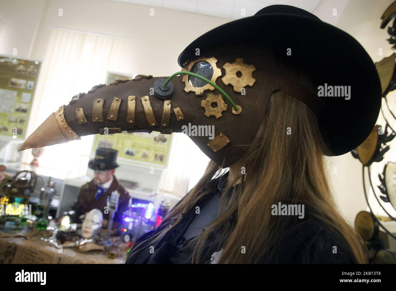 Participants dressed in steampunk cosplay costumes attend the ...