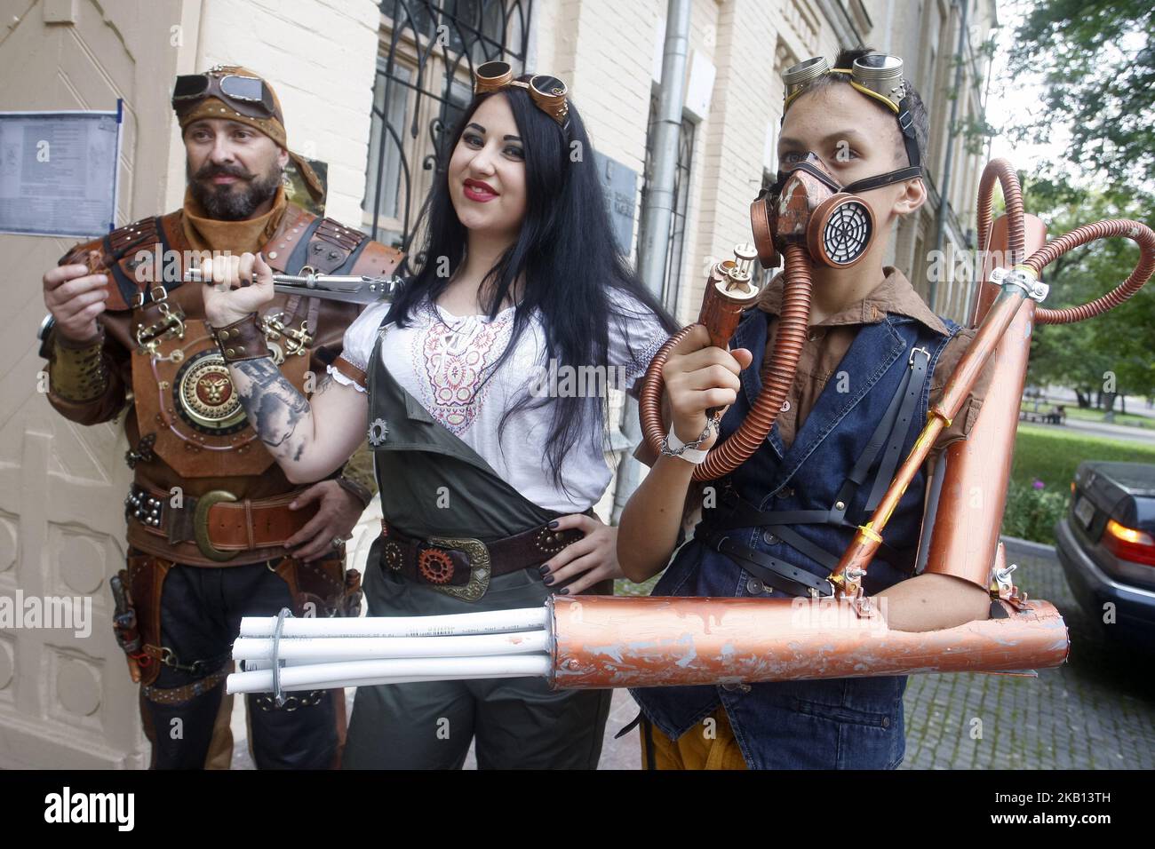 Participants dressed in steampunk cosplay costumes attend the ...