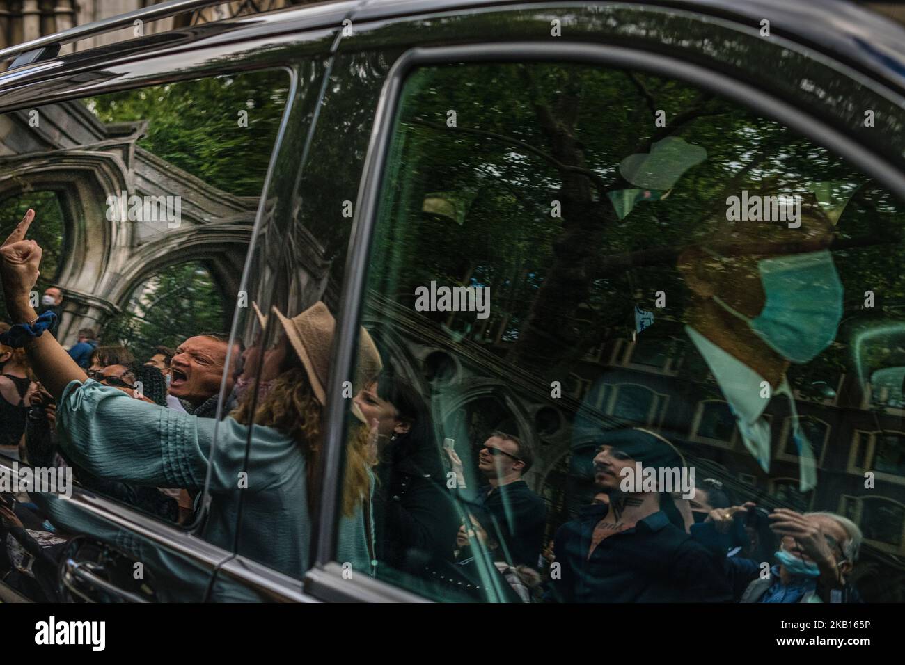 Amber Heard leaving in a blacked out limousine outside the Royal Courts ...
