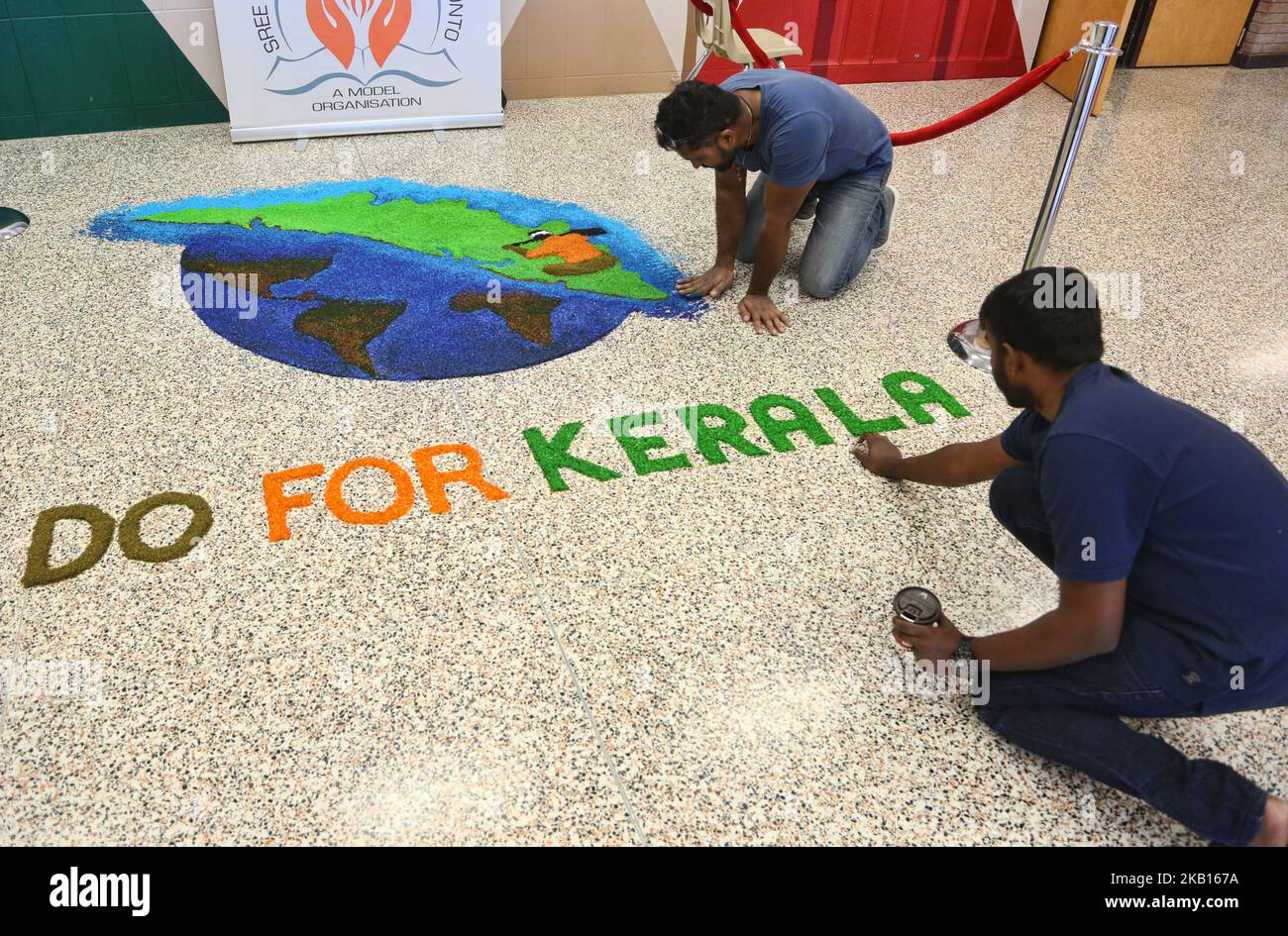Youth create a colourful rangoli (rangoli, also known as kolam, is a ...