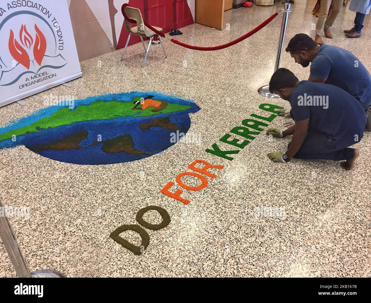 Youth create a colourful rangoli (rangoli, also known as kolam, is a ...