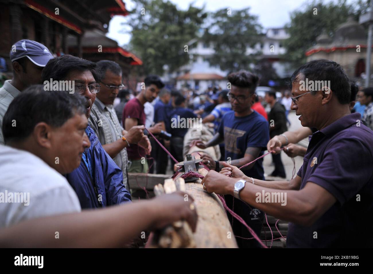 Nepalese devotees from manandhar community arranging rope for tomorrow ...