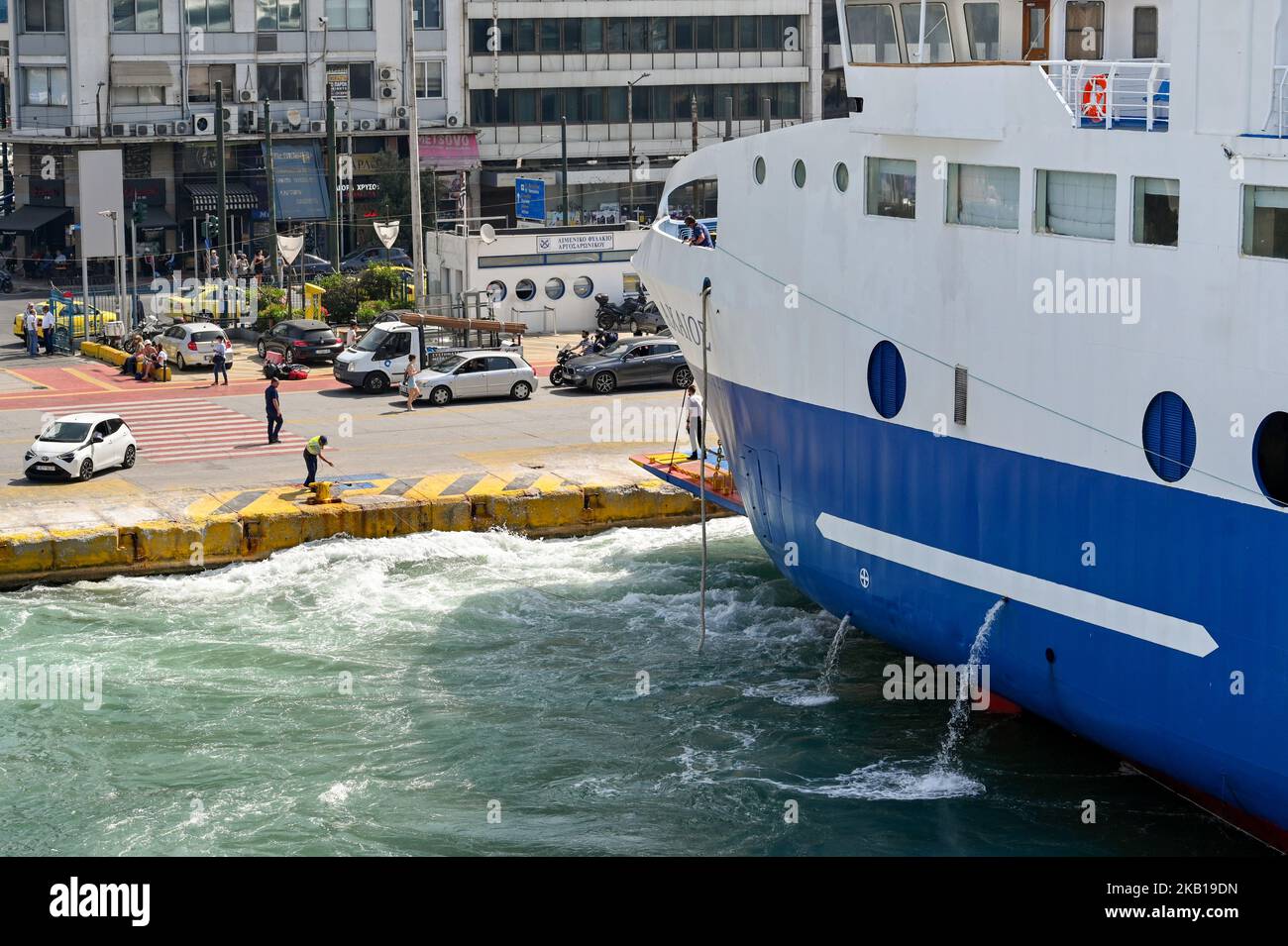 Piraeus, Athens, Greece - June 2022: Large ferry being guided into dock ...