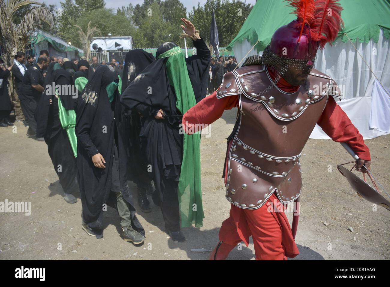 Iranian Shiites in costumes re-enact events of Ashoura in Tehran, Iran ...