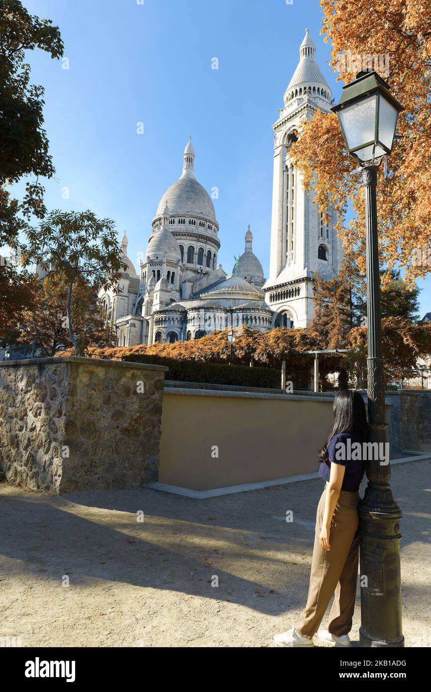 The basilica Sacre Coeur with autumnal trees . It is a Roman catholic ...