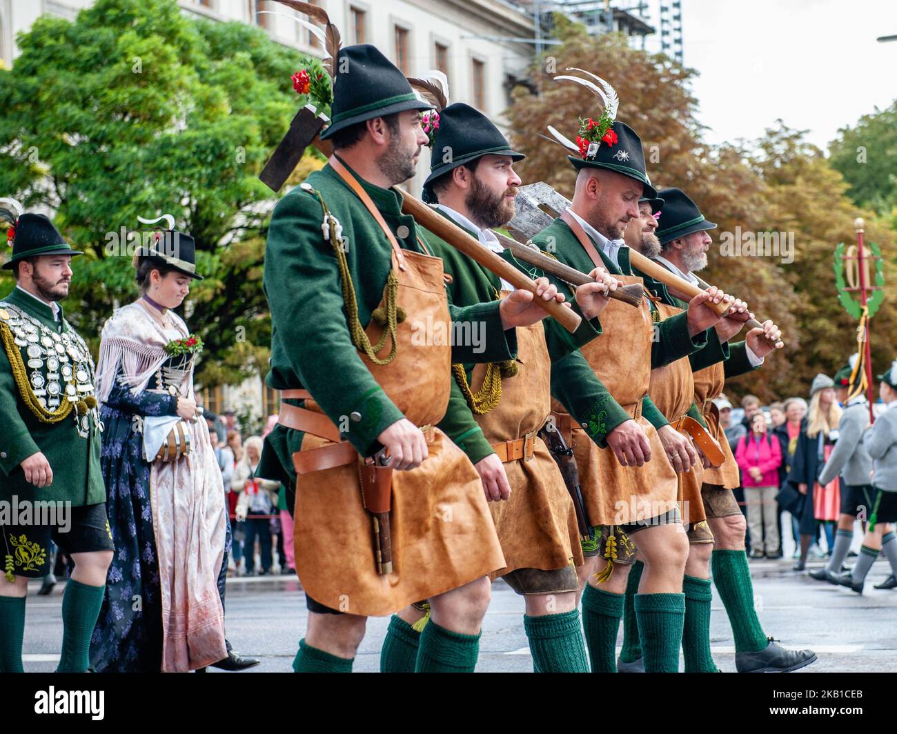 Members of a traditional Bavarian marching band drink beer in the ...