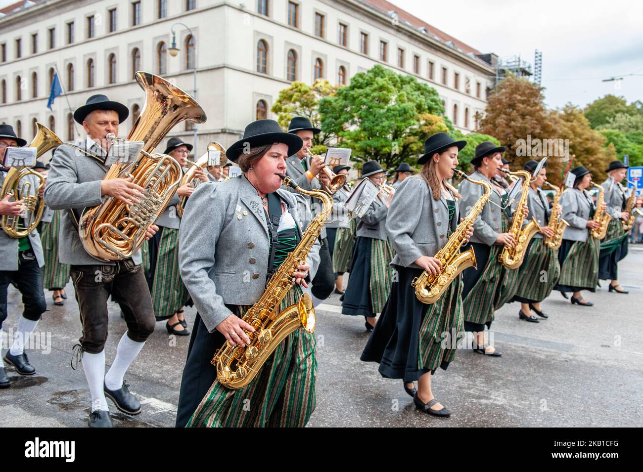 Members of a traditional Bavarian marching band drink beer in the ...