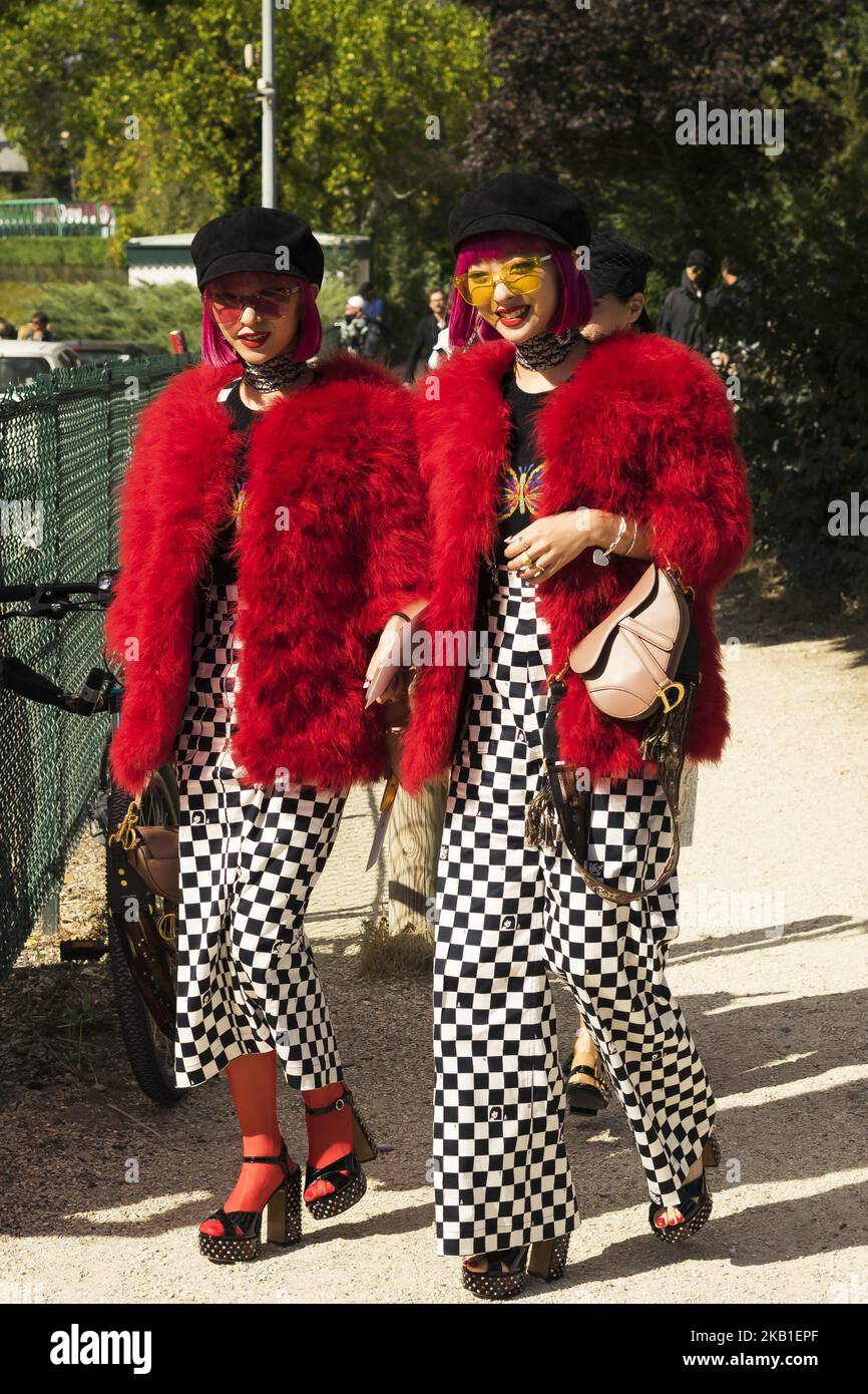 Japanese twin sisters of the band Amiaya attend the Christian Dior show ...