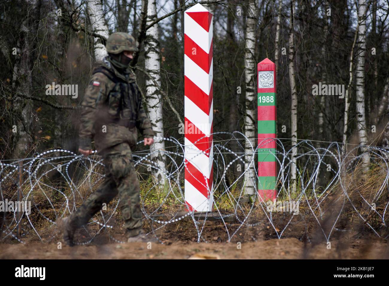 Polish and Russian landmarks are seen next to the razor wire fence ...