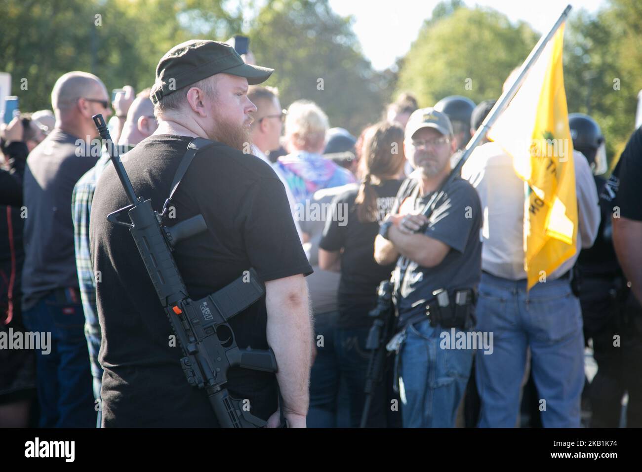 Men with guns gather during an open carry rally at Kent State ...