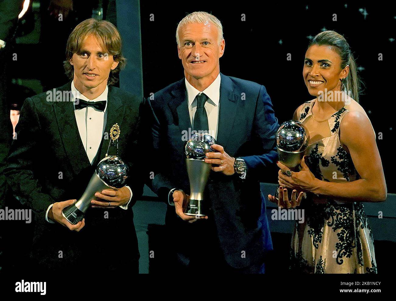 Luka Modric, Didier Deschamps and Marta pose for a photo with their ...