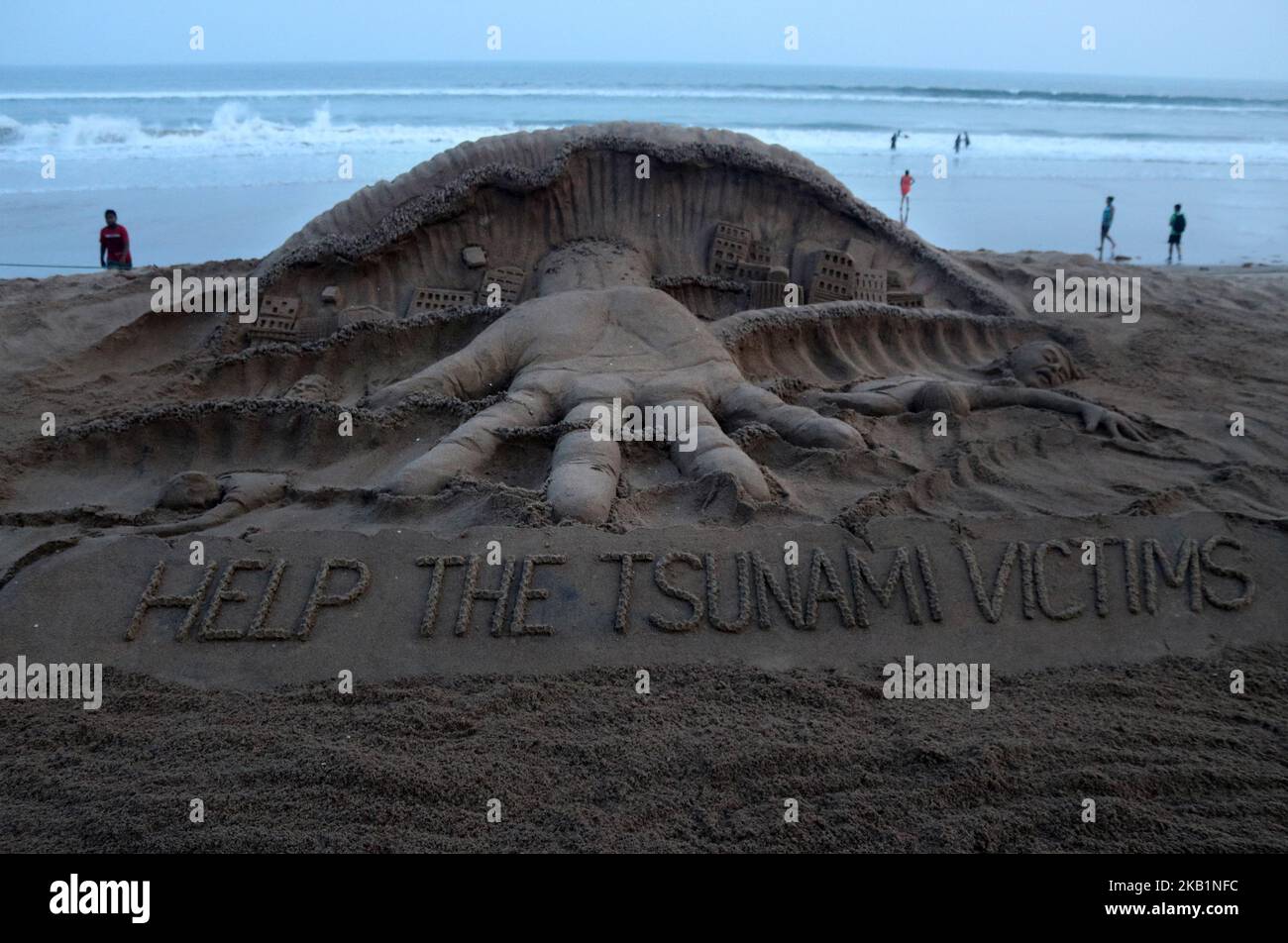 A sand sculpture is seen at the Bay of Bengal Sea's eastern coast beach ...