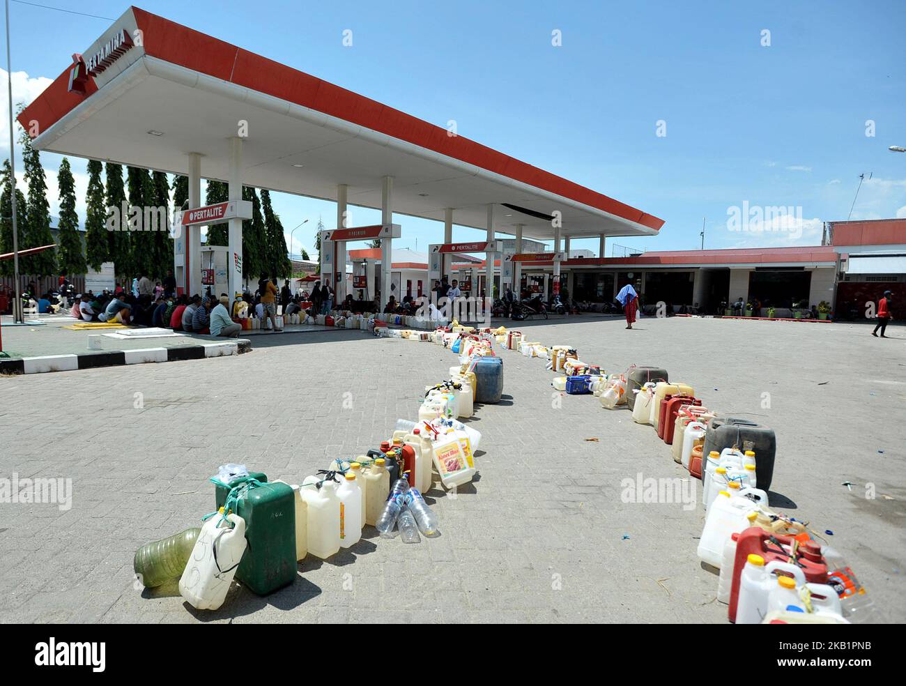 Thousands of Cans line up neatly waiting to be filled in at a gas ...