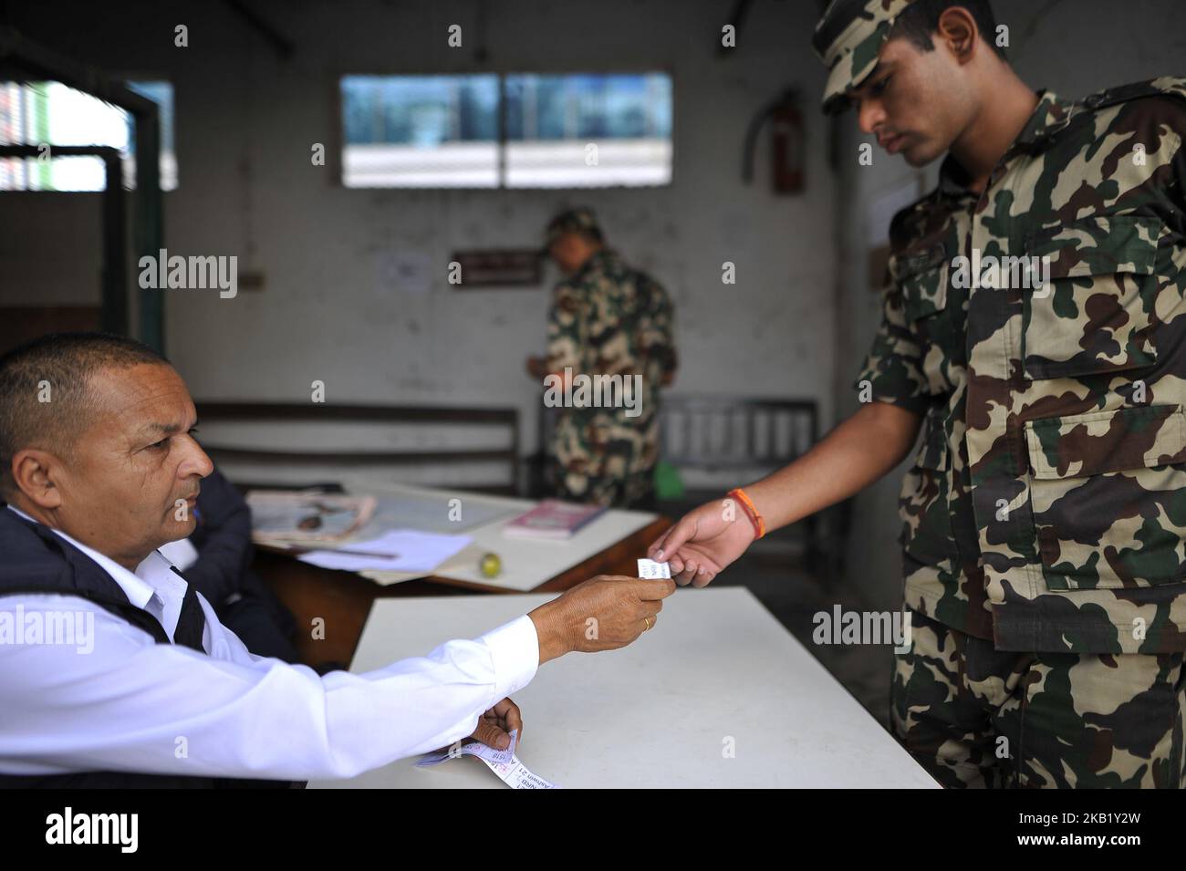 Staff of Nepal Rastra Bank give token to exchange new notes for the ...