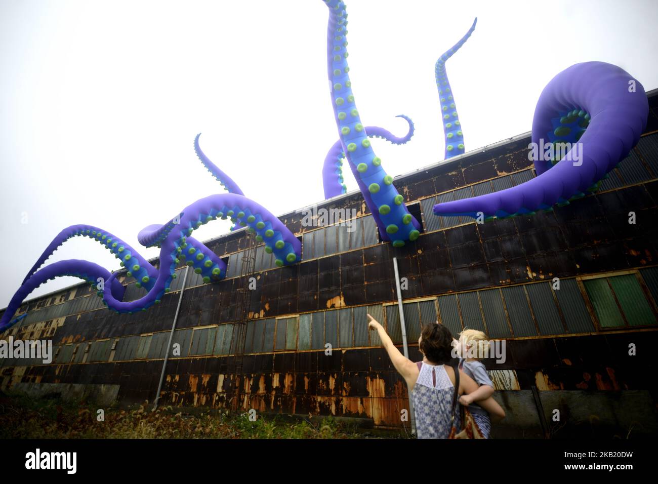 Spectators interact with the inflatable tentacles of a commissioned art ...