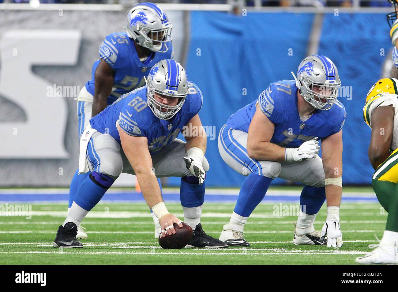 Detroit Lions center Graham Glasgow (60) prepares to snap the ball ...