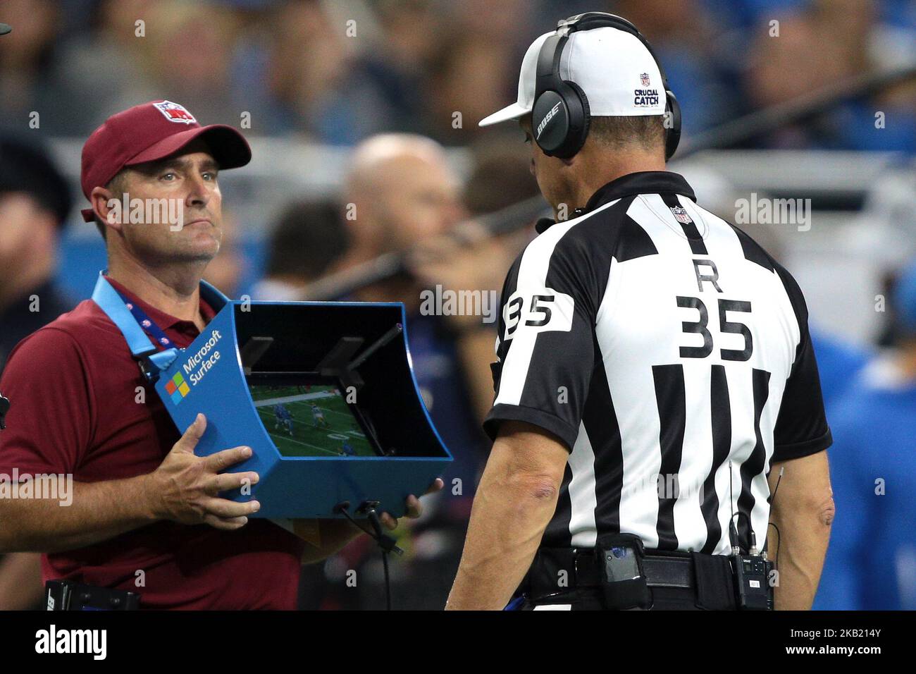 Referee John Hussey reviews a play during the first half of an NFL ...