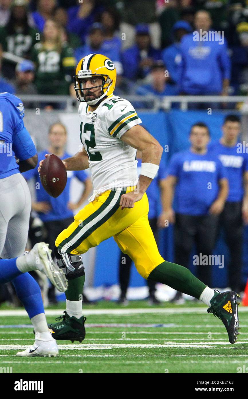 Green Bay Packers quarterback Aaron Rodgers (12) looks to pass under ...