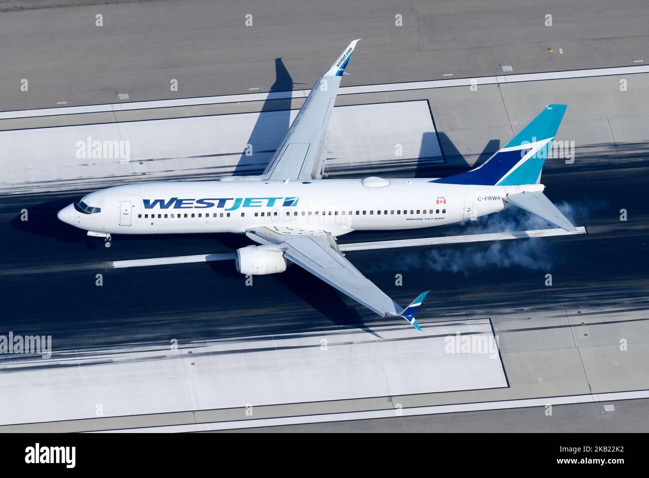 WestJet Boeing 737 aircraft landing aerial view. Airplane C-FRWA ...
