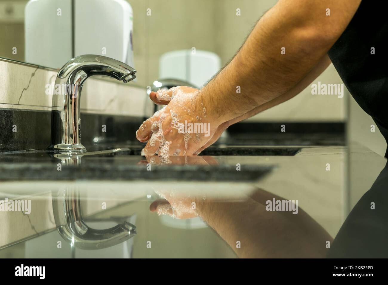 Man cleaning disinfecting hands hi-res stock photography and images - Alamy