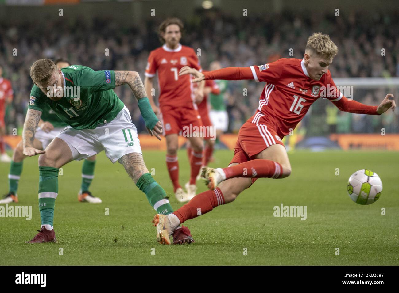 James McClean of Ireland duels with David Brooks of Wales during the ...