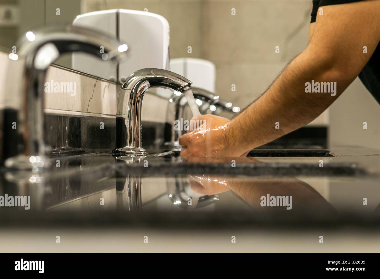 Man cleaning disinfecting hands hi-res stock photography and images - Alamy