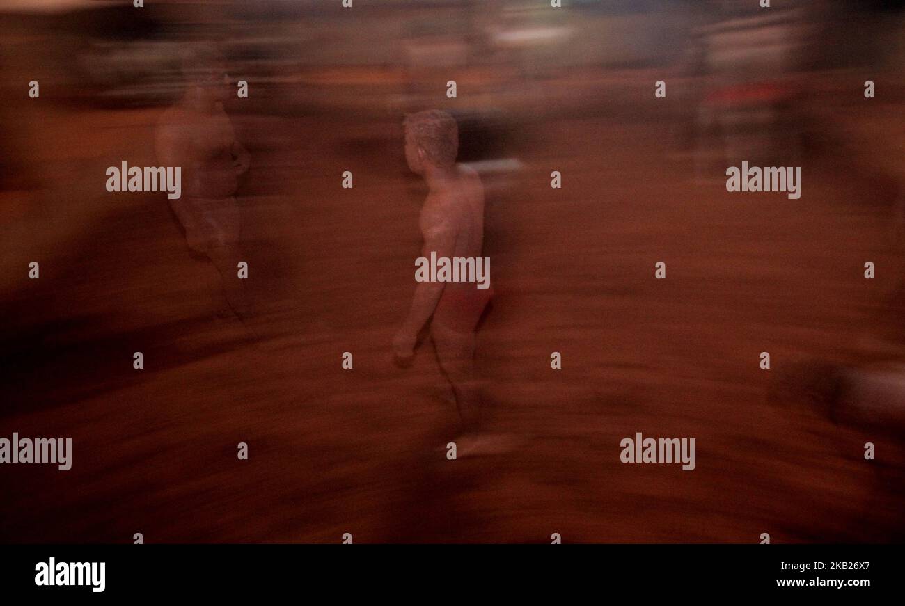 Indian man (Pehlwan) practice Kushti a form of wrestling at a taleem ...