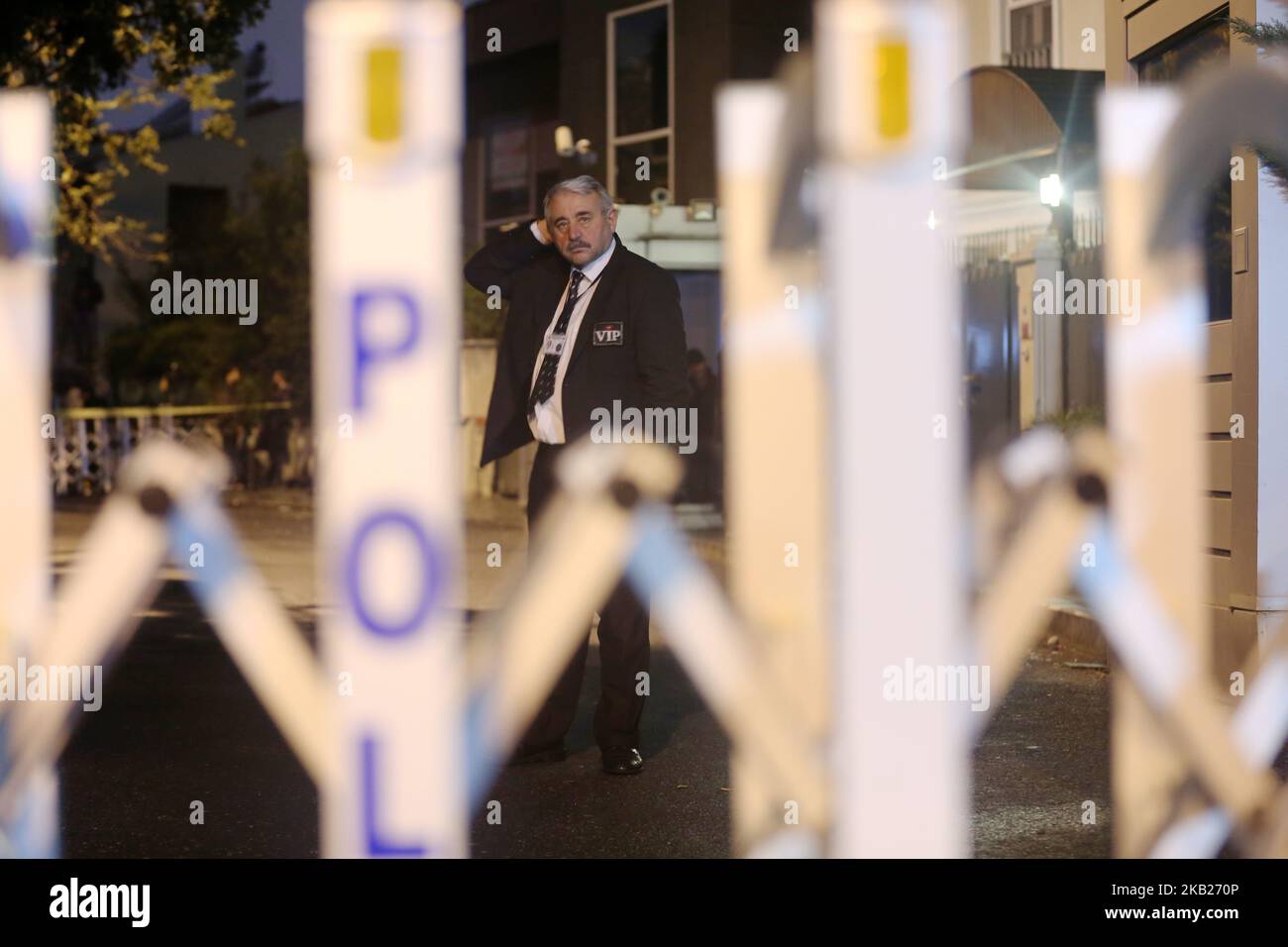 Officials wait in front of the residence of Consul General of Saudi ...