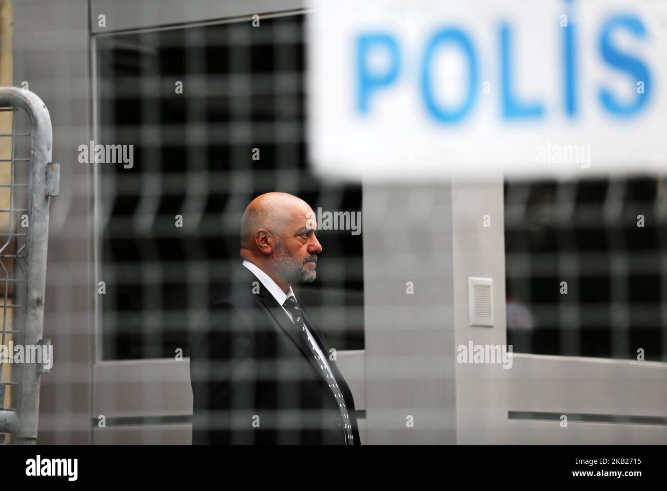 An official stands in front of the Saudi consulate in Istanbul, Turkey ...