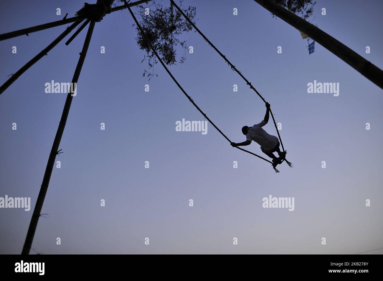 Nepalese people playing on a traditional bamboo ping or swing during ...