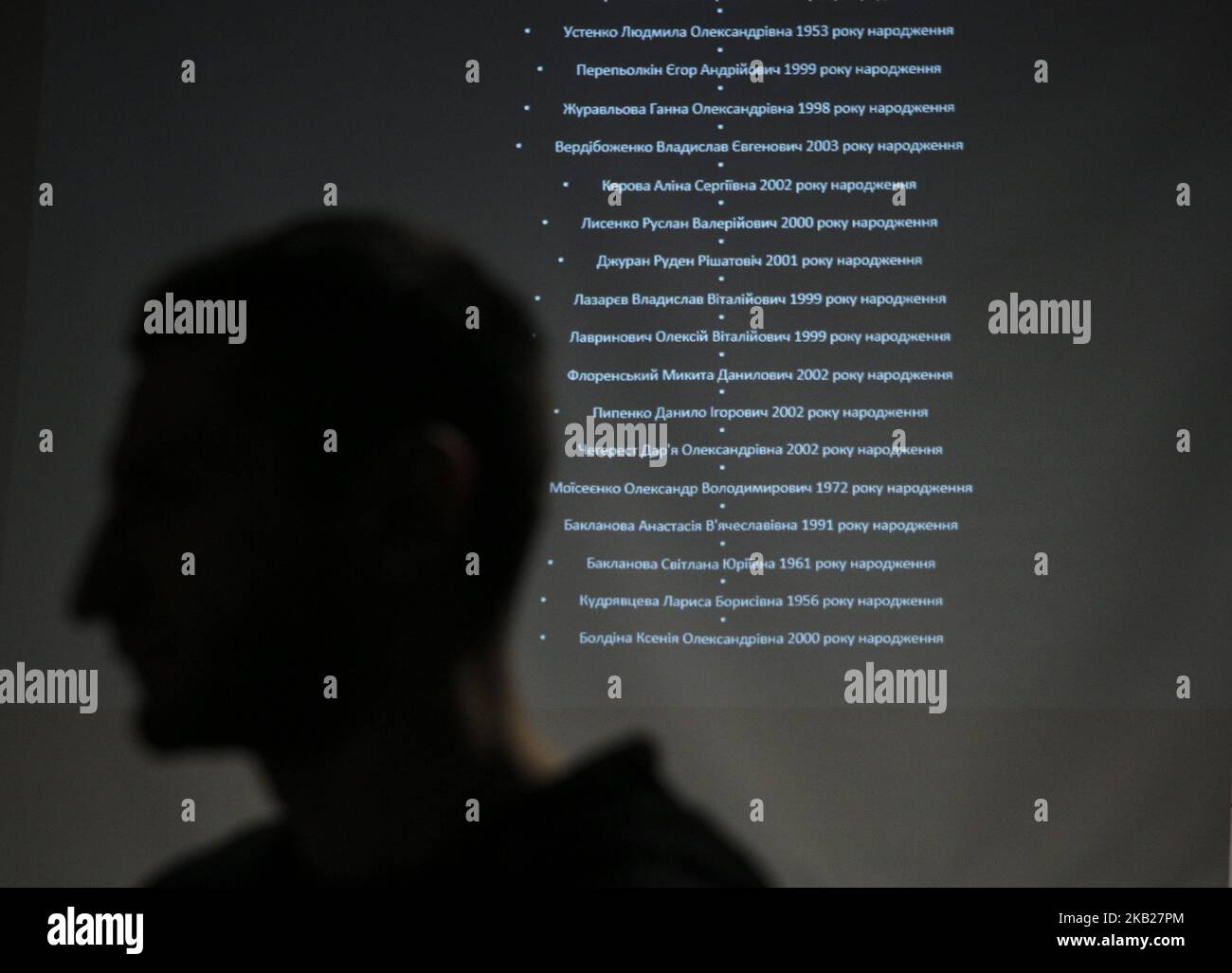 Ukrainians sign a condolence book as a sign of mourning in front of the ...