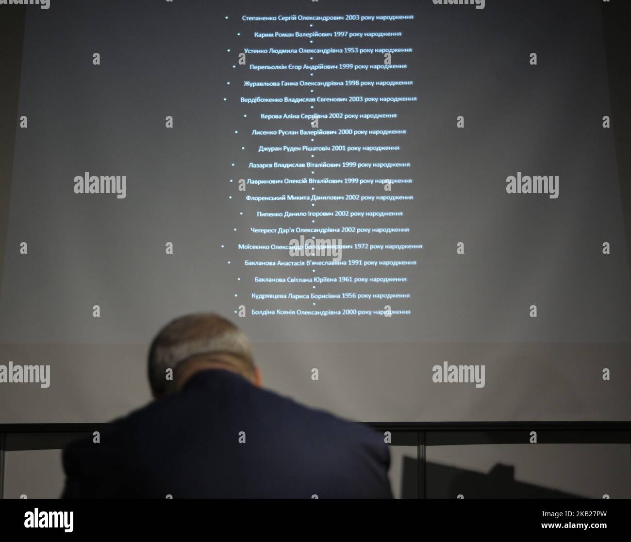 Ukrainians sign a condolence book as a sign of mourning in front of the ...