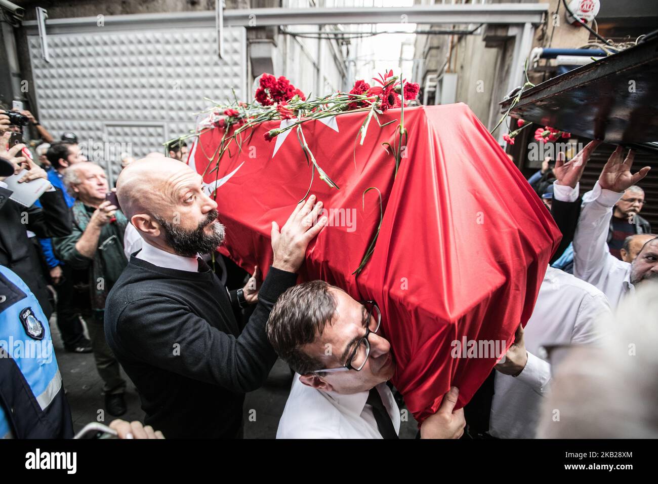 Turkish photographer Ara Guler's coffin is carried into the Uc Horon ...