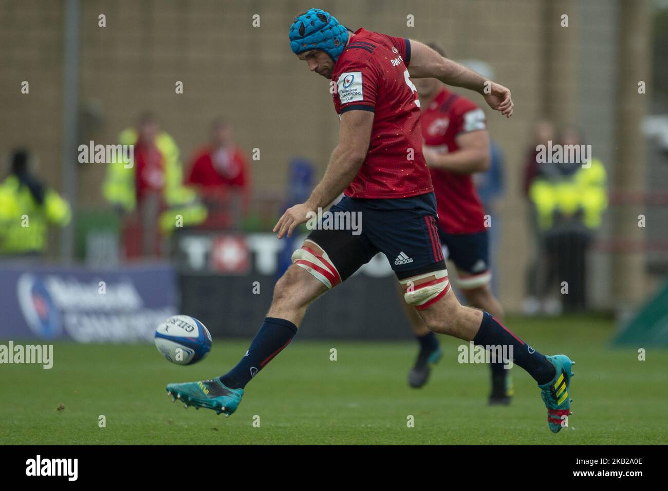 Tadhg Beirne of Munster kicks the ball during the Heineken Champions ...