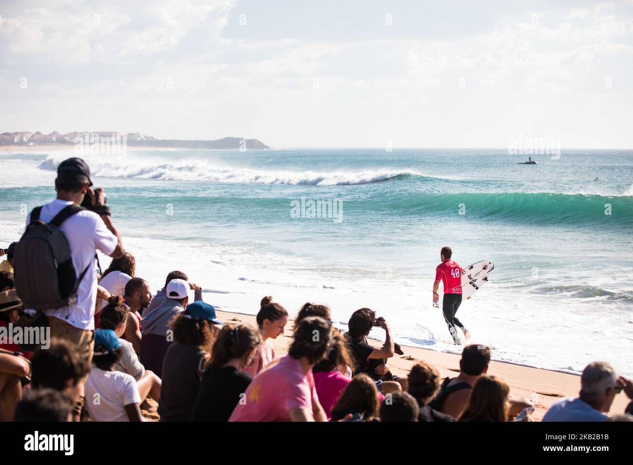 French surfer Joan Duru prepares to enter the water (Photo by Henrique ...