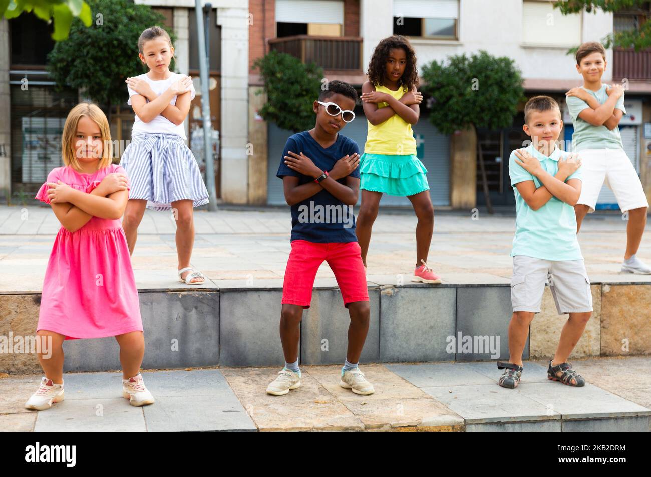 Group of kids performing street dance outdoors Stock Photo - Alamy