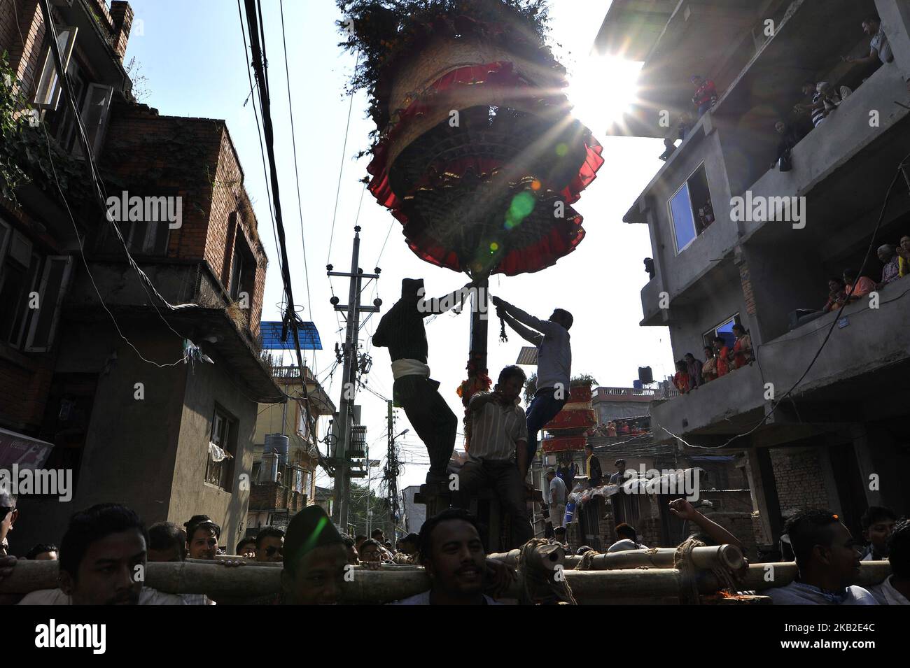 Locals carry as well as rotates top part of a chariot of Lord Narayan ...