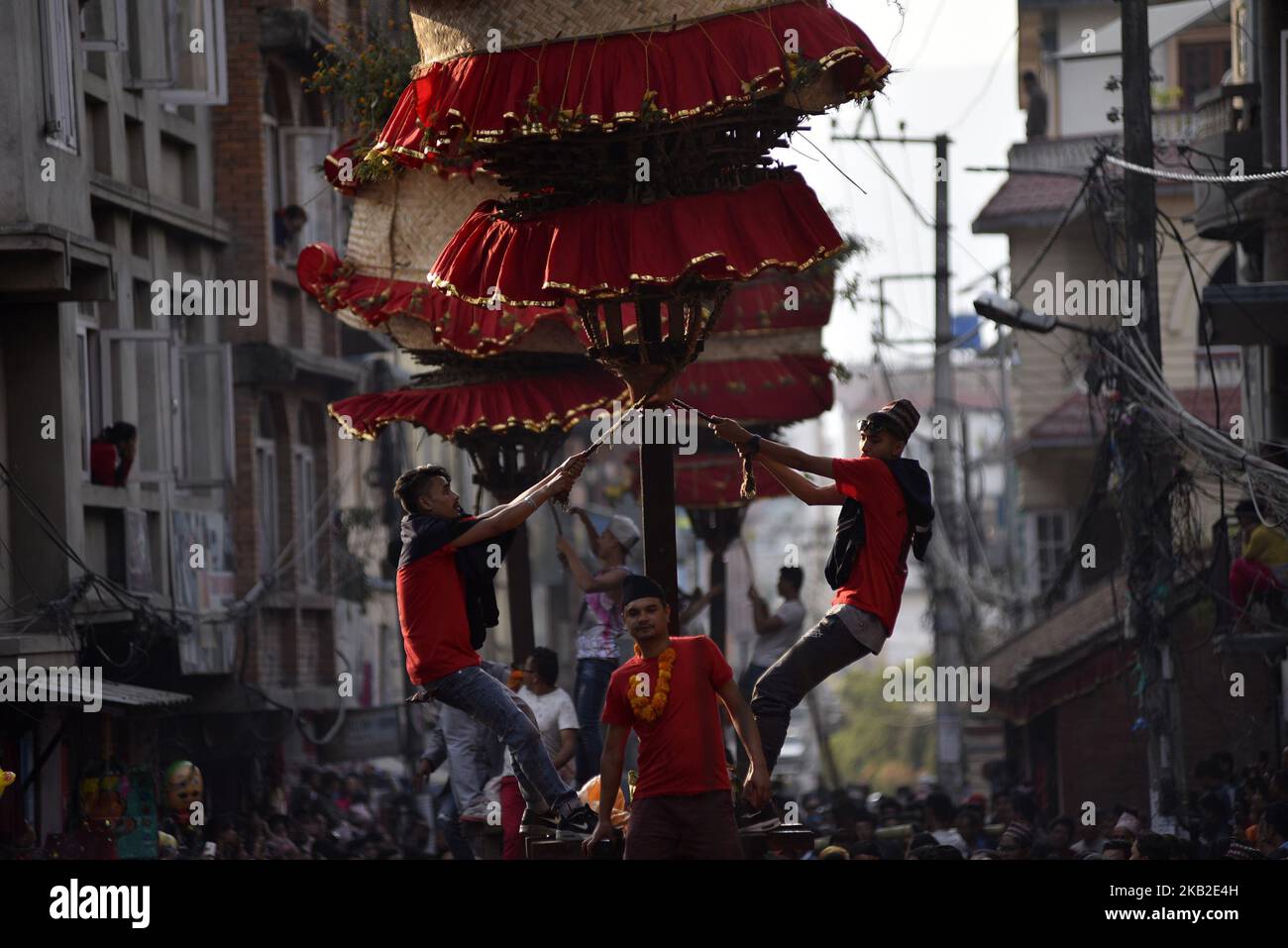 Locals carry as well as rotates top part of a chariot of Lord Narayan ...