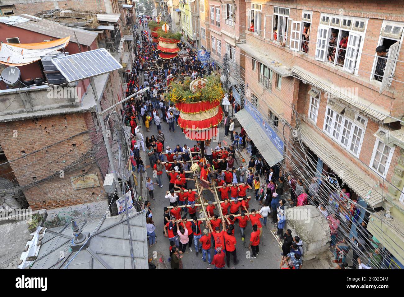 Locals carry as well as rotates top part of a chariot of Lord Narayan ...